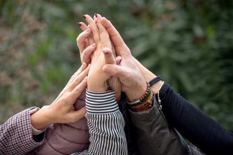 A Group of People Putting Their Hands Together As a Symbol of Unity ...