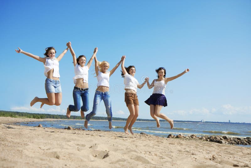 Group of People Relaxing on the Beach Stock Photo - Image of playful ...