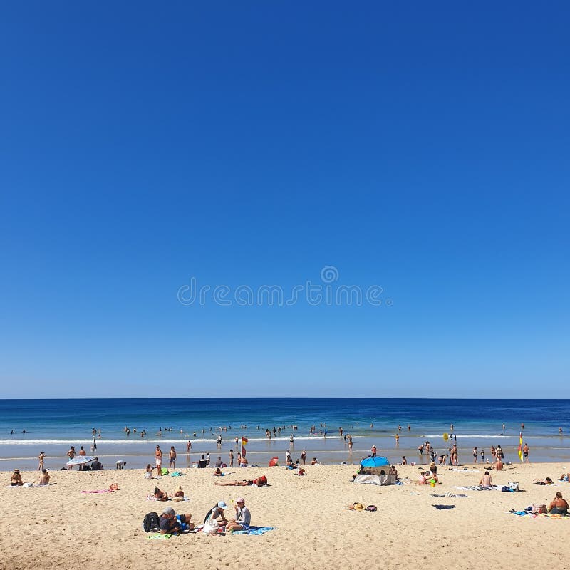 Group of People Relaxing on Sand at the Beach Editorial Photography ...