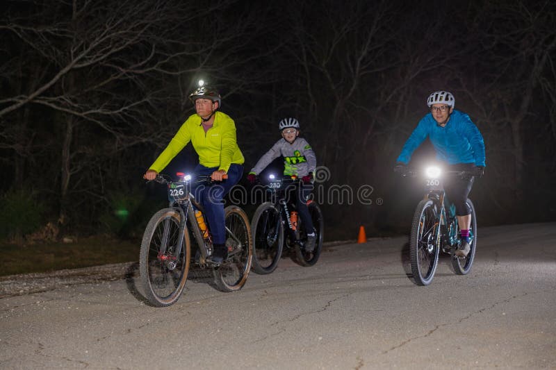 Group of People Riding Mountain Bikes at Night. Texas Editorial ...