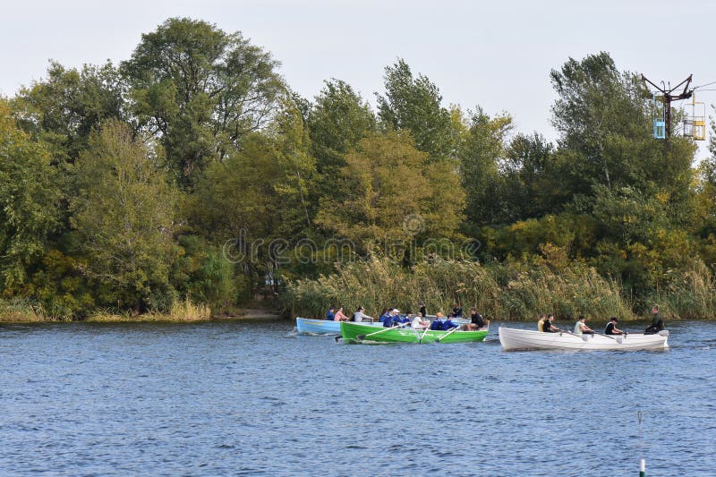 A Group of People Rowing in a Rowboat on the River Stock Photo - Image ...