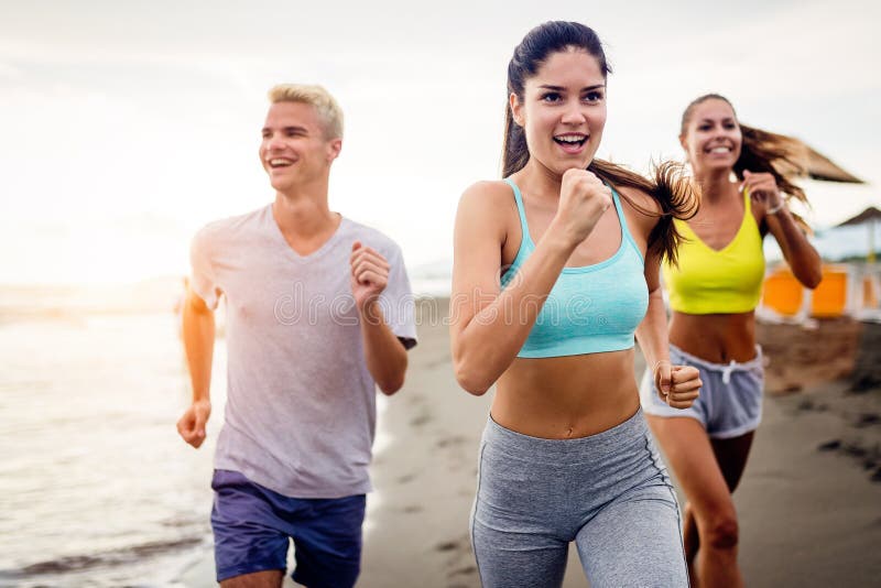 Group of People, Friends Running on the Beach at Sunset Stock Image ...