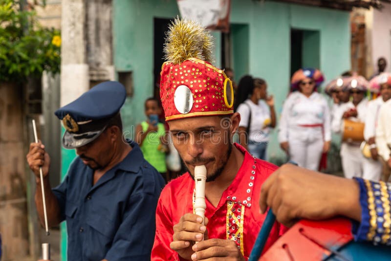 Group of People Singing and Dancing during a Parade on the Streets of ...