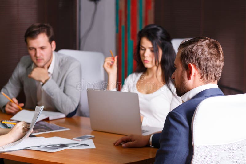 A Group of People Sit at the Desk on an Interview in the Office. Stock ...