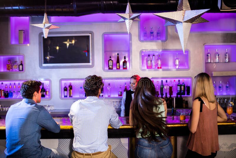 Group of People Sitting in Bar Counter Stock Image - Image of luxury ...