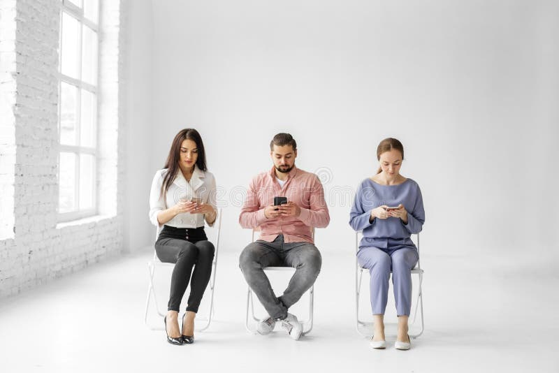 Group of People Sitting on Chairs and Using Digital Devices, Concept ...