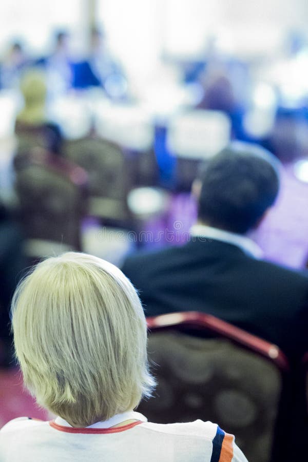 Group of People Sitting in Front of the Big Screen during Conference ...
