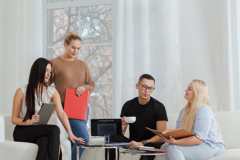 A Group of People are Sitting on a Sofa and Discussing Work Issues ...