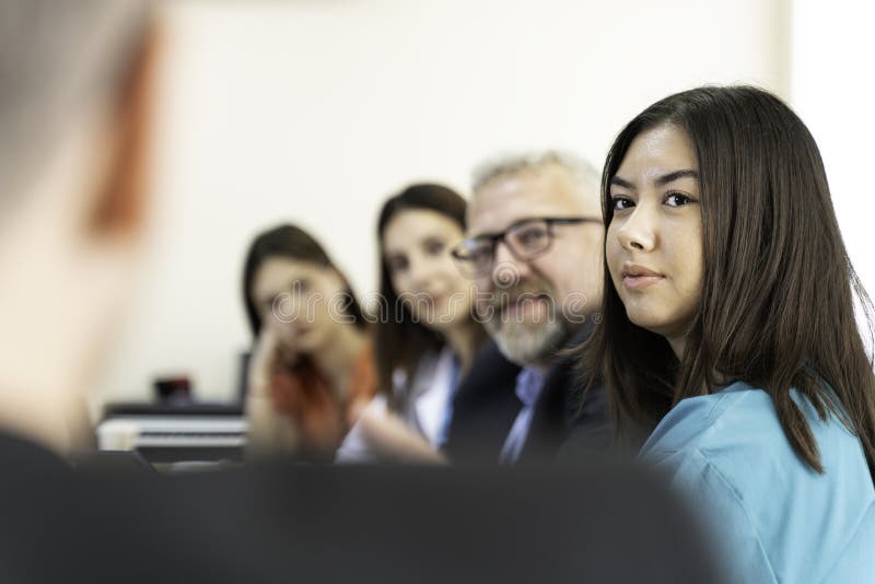 Group of Doctors and Nurses Working Together in a Conference Room at ...