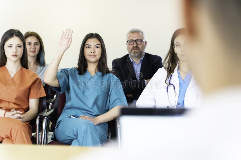 Group of Doctors and Nurses Working Together in a Conference Room at ...