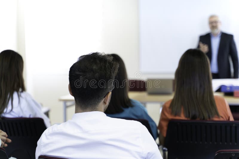 Group of Doctors and Nurses Working Together in a Conference Room at ...