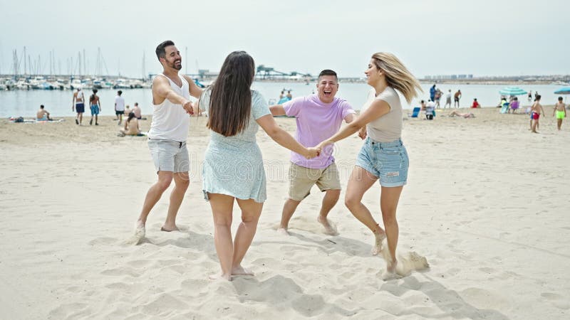 Group of People Smiling Confident Dancing with Hands Together at Beach ...
