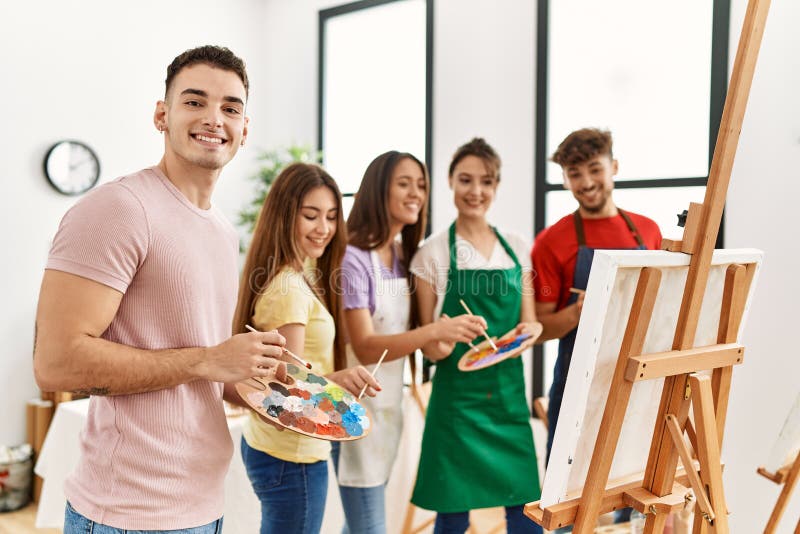 Group of People Smiling Happy Drawing on Canvas Standing at Art Studio ...