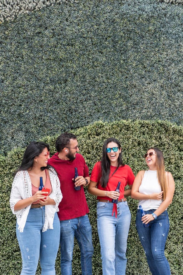 Group of People with Soda Bottles Talking in the Open Air Stock Image ...