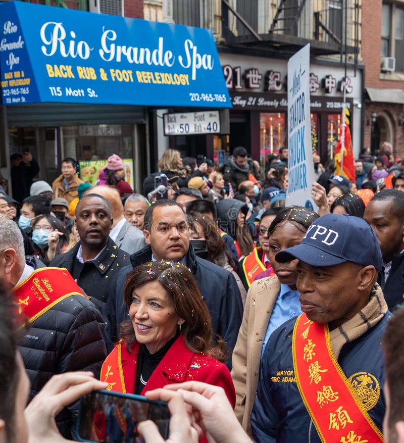 Group of People Standing on a Busy Street Corner, with a Multitude of ...