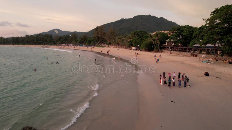 A Group of People Stood in a Circle on the Beach Stock Video - Video of ...