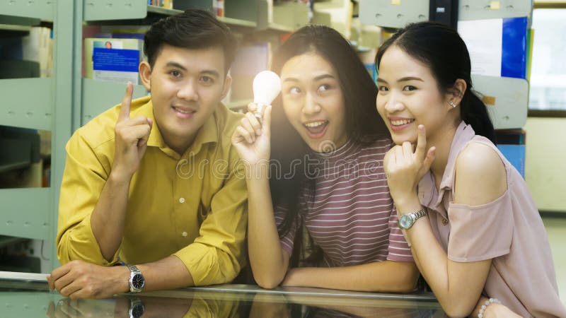 Group of People Students Hold the Light Bulb with the Light Inside and ...