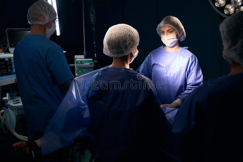 Group of People in Surgical Overalls Stand at Operating Table Stock ...