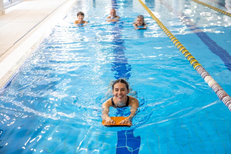 Group of People Swimming in the Swimming Pool and Looking Enjoyed Stock ...