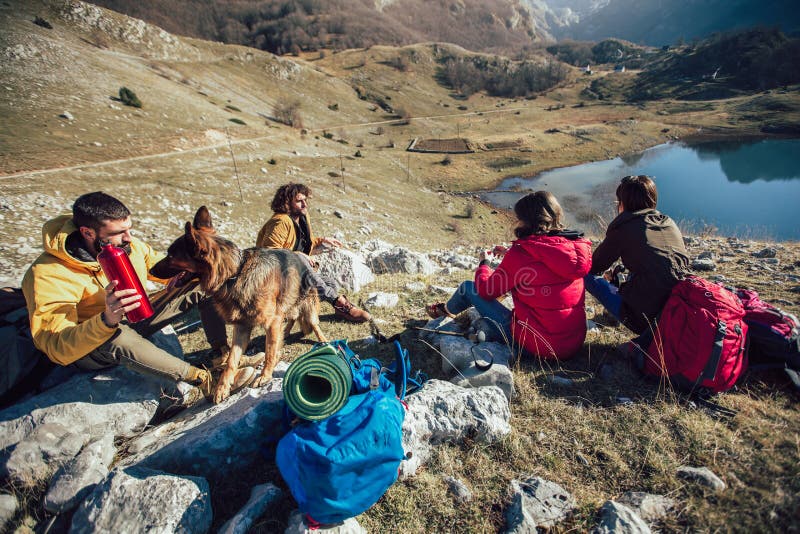 People Taking a Break, Relaxing during a Hike Stock Photo - Image of ...