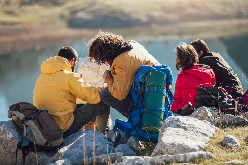 Group of People Taking a Break, Relaxing during a Hike Stock Photo ...
