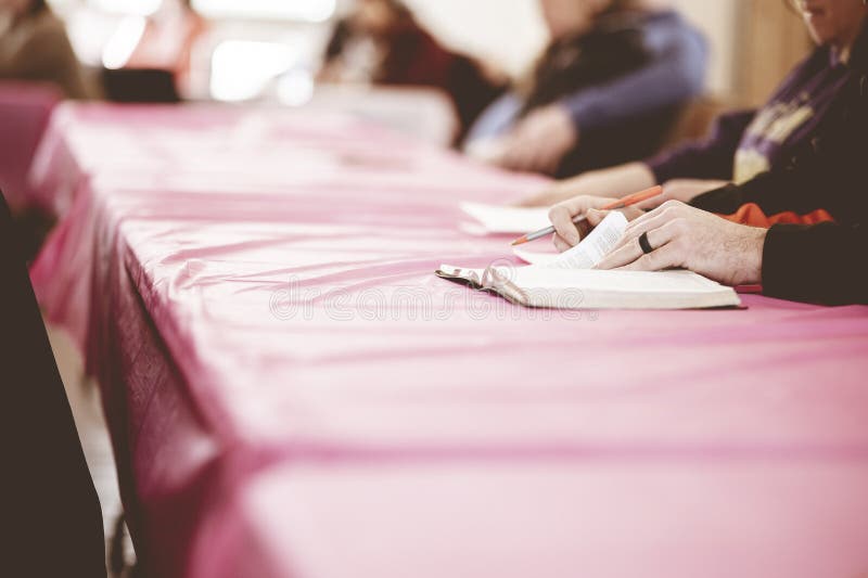 Group of People Taking Notes in Notebooks Sitting at the Table Stock ...