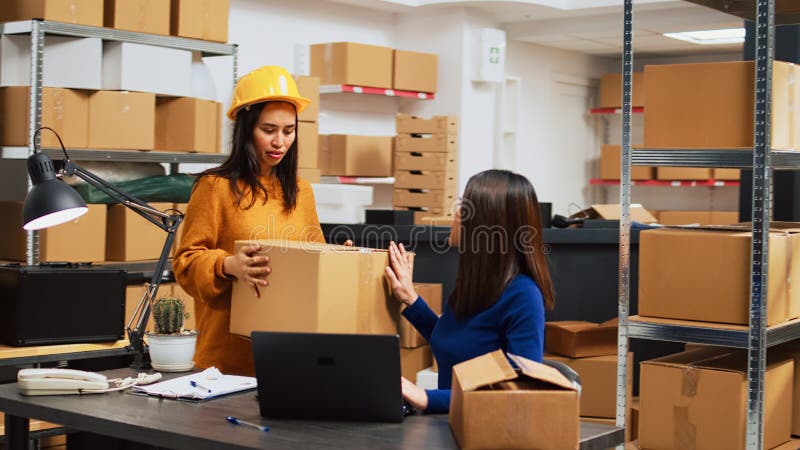 Group of People Using Laptop To Plan Distribution in Depot Stock Photo ...