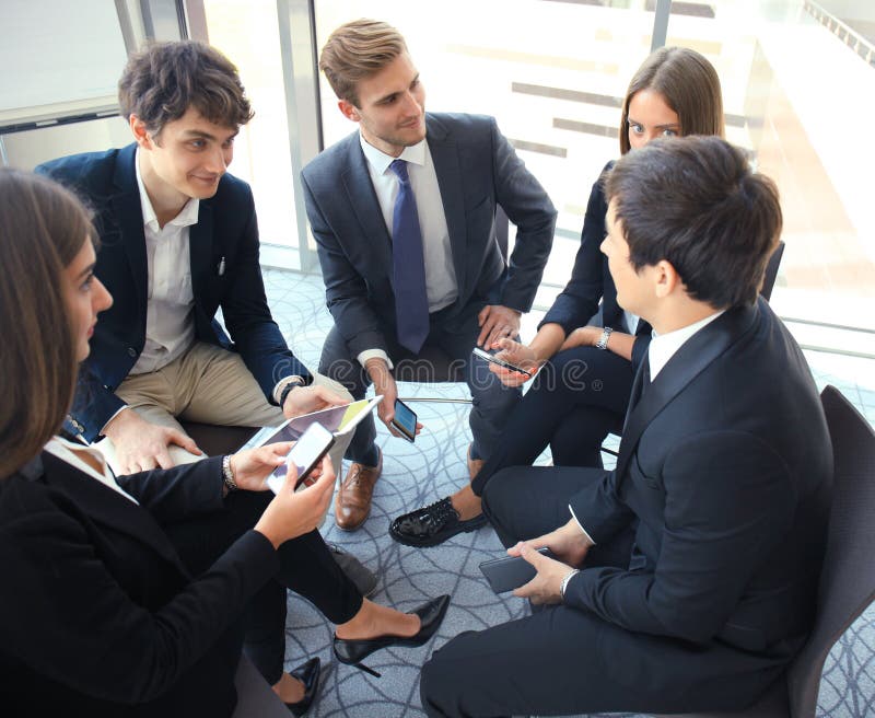 Group of People Using Smart Phones Sitting at the Meeting. Stock Photo ...