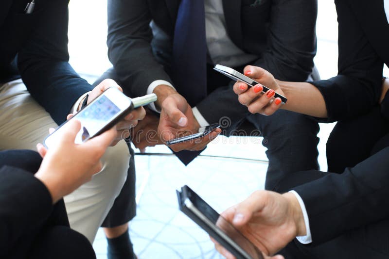 Group of People Using Smart Phones Sitting at the Meeting, Close Up on ...