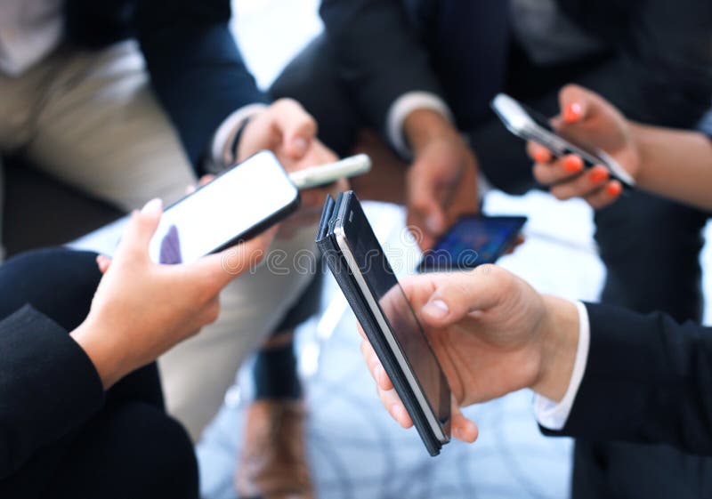 Group of People Using Smart Phones Sitting at the Meeting, Close Up on ...
