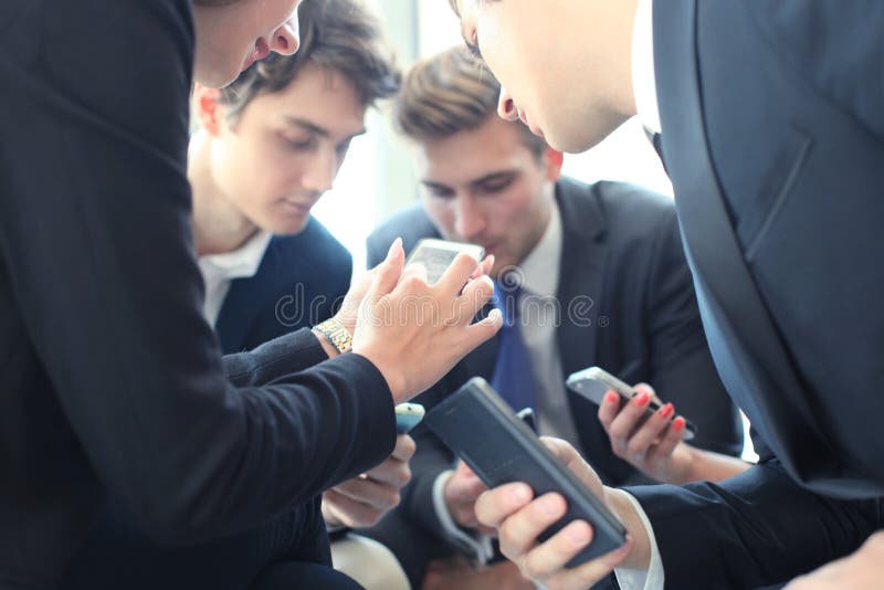 Group of People Using Smart Phones Sitting at the Meeting, Close Up on ...