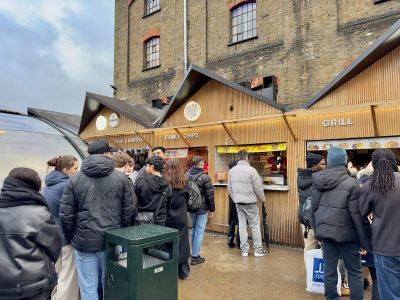 A Crowd of People Standing in Line at a Food Stand Editorial Image ...