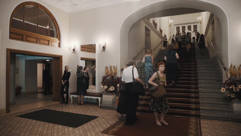 People Walk Up Staircase in Old Style Classical Concert Hall Corridor ...