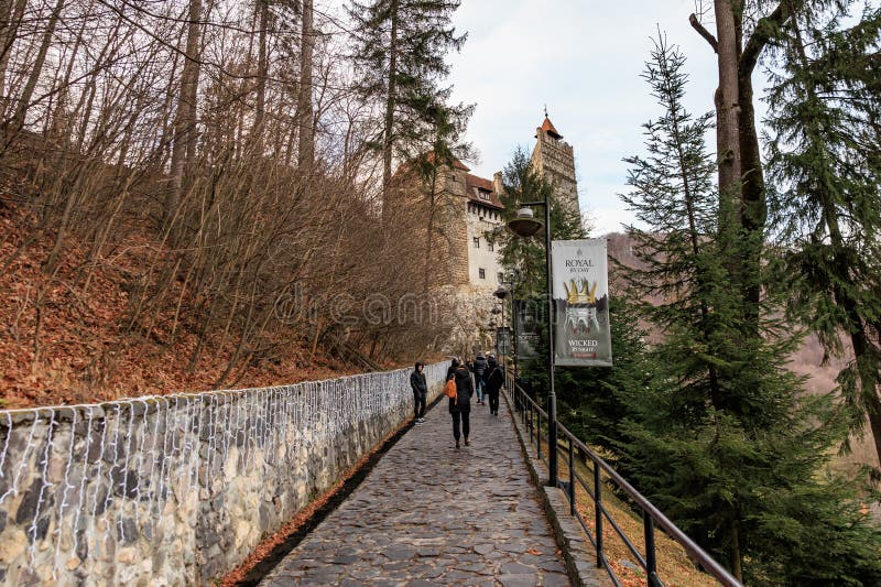 Group of People Walking Down a Path, Castle of Count Dracula. December ...
