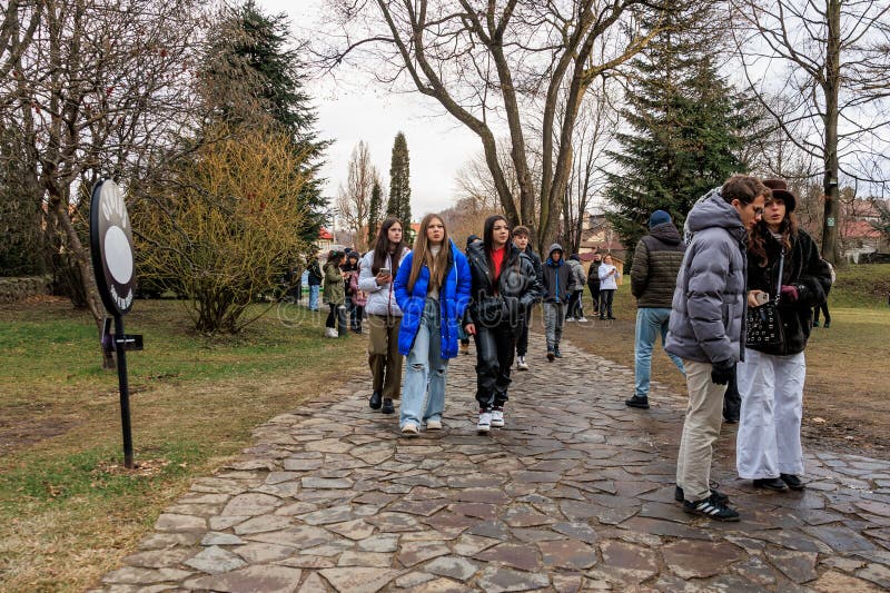 Group of People Walking on a Path in a Park. December 16, 2024 Bran ...