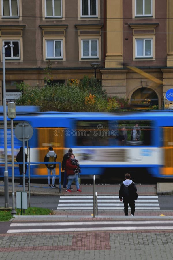 Group of People Walking on a Sidewalk, Approaching the Public Bus ...