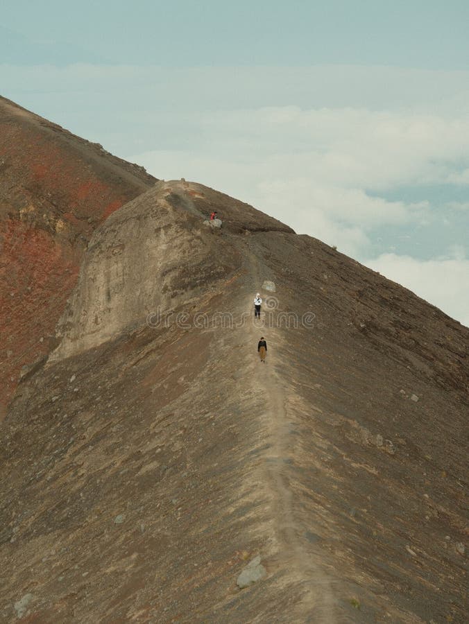 A Group of People are Walking Up a Steep Mountain Stock Image - Image ...