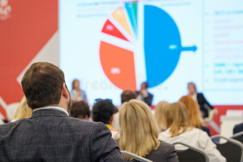 Group of People Watching Presentation on Large Screen Editorial Stock ...