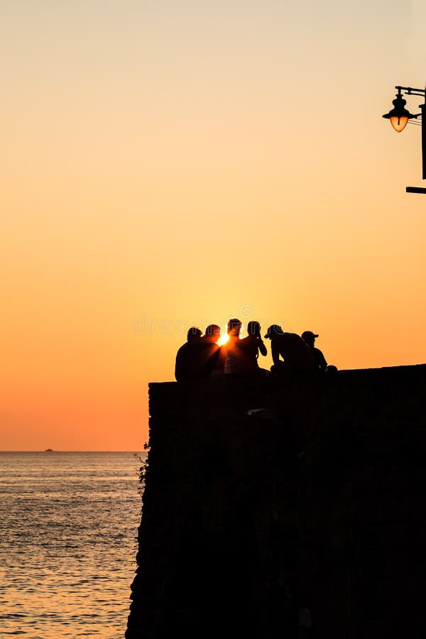 People in Camping Sitting Near Campfire Against Sunset Stock Image ...