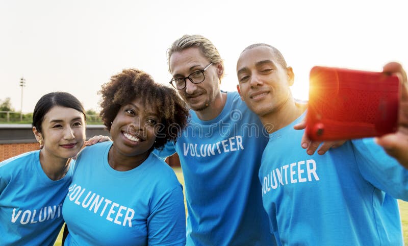 Group Of People Wearing Blue Volunteer Shirts Picture. Image: 116853954
