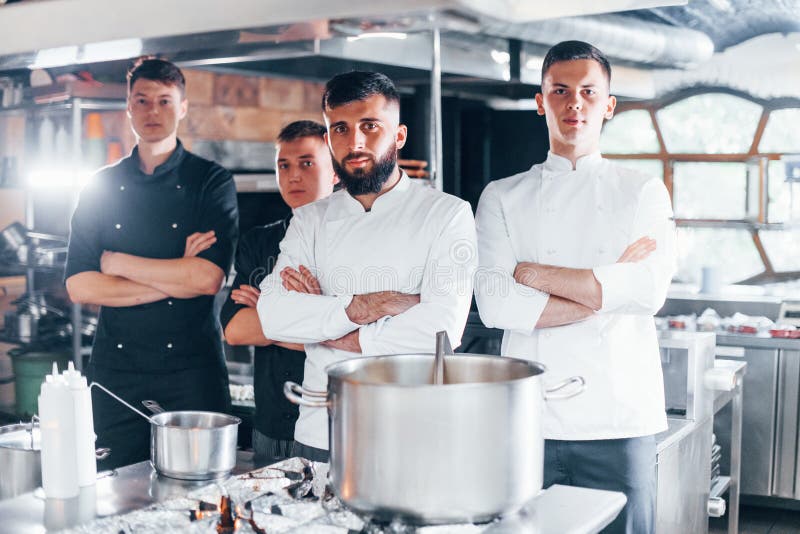Group of People in White Uniform Standing Together at Kitchen. Cooking ...