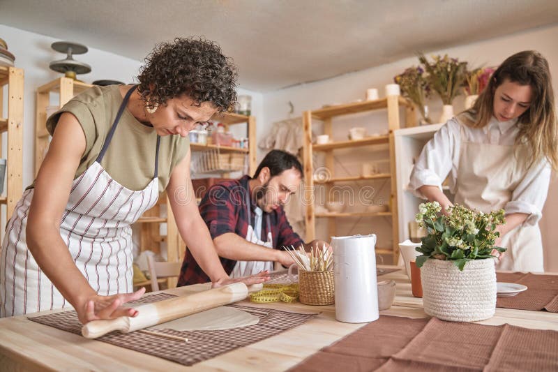 Group of People Working with Clay in a Pottery Class. Stock Photo ...