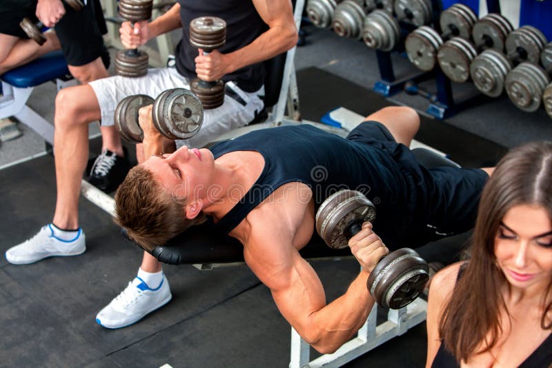 Group of People Working with Dumbbells at Gym Stock Image - Image of ...