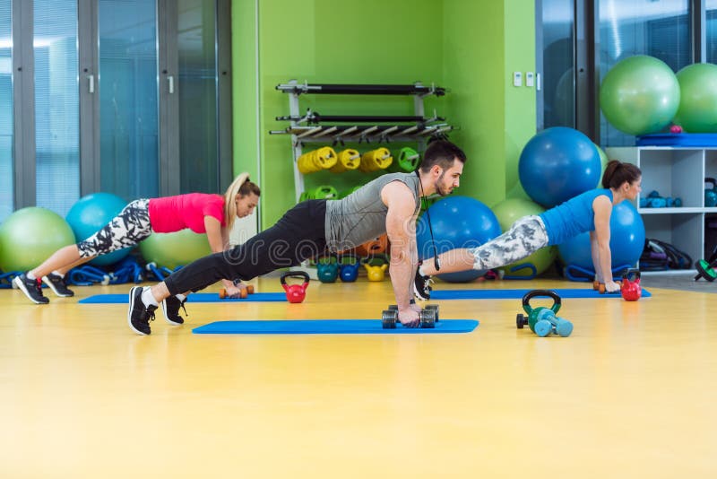 Group of People Working Out in a Gym with a Dumbbell Stock Image ...