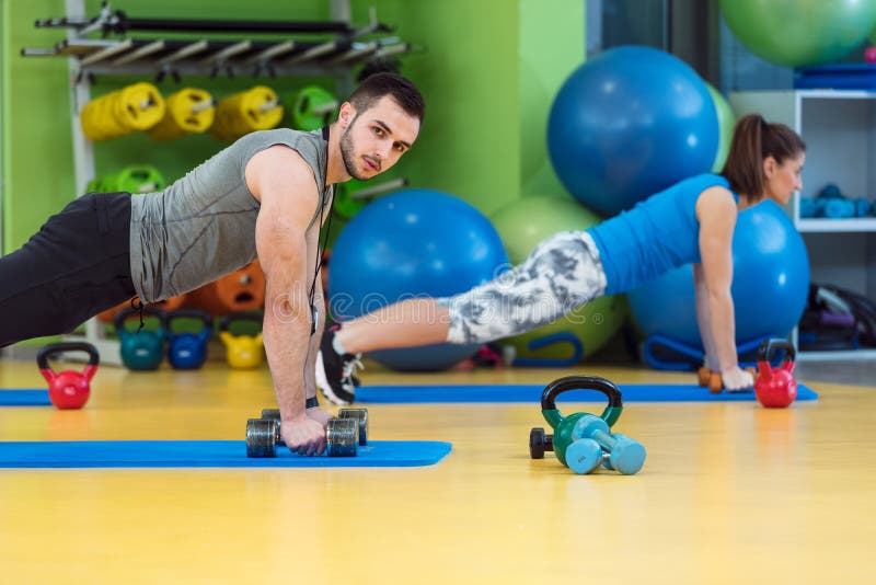 Group of People Working Out in a Gym with a Dumbbell Stock Image ...