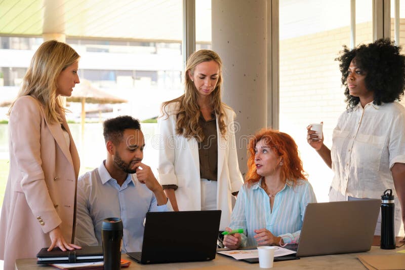 Group of People Working Together on a Project in a Startup Company ...