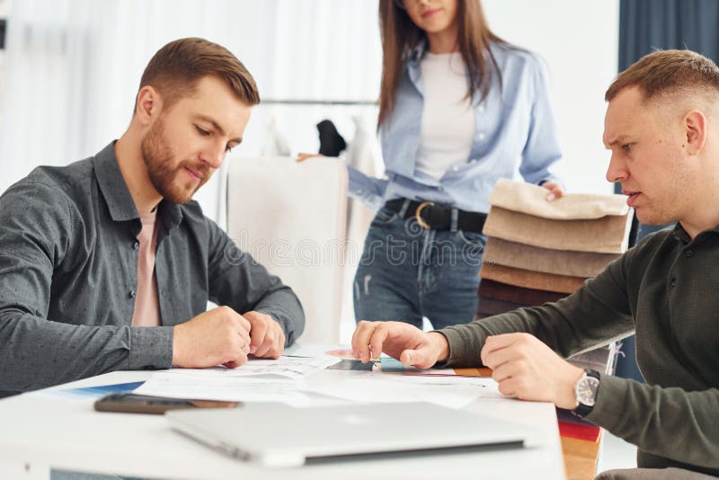 Group of People Works in the Office by Sitting by the Table Stock Photo ...