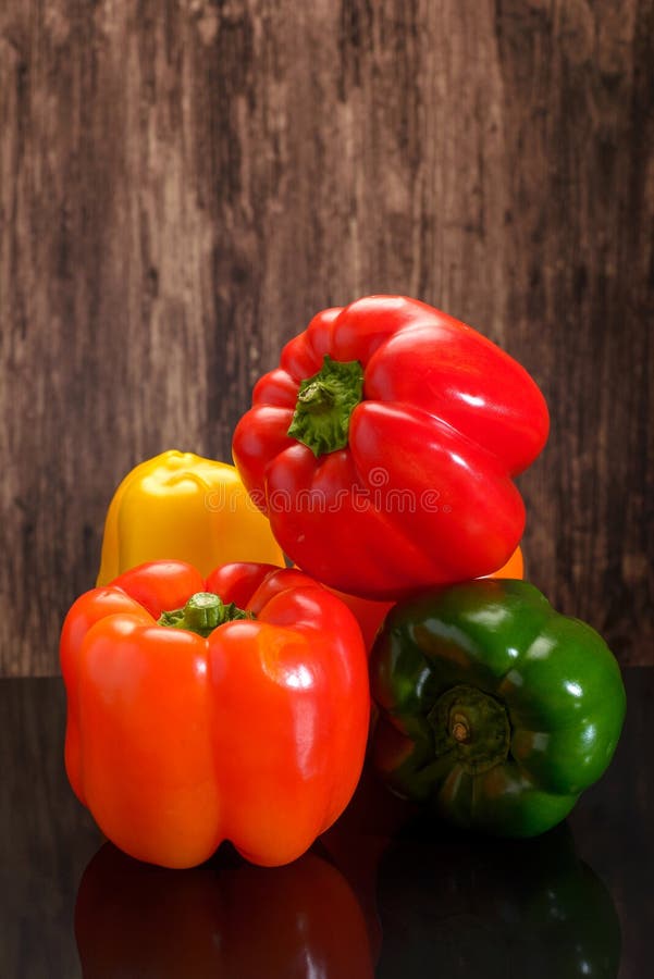 Group of Peppers of Different Colors on a Wooden Table. Stock Photo ...