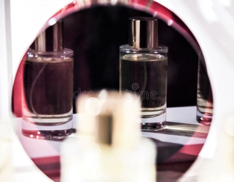 Perfume Flacons in a Mirror Stock Image - Image of lady, feminine ...