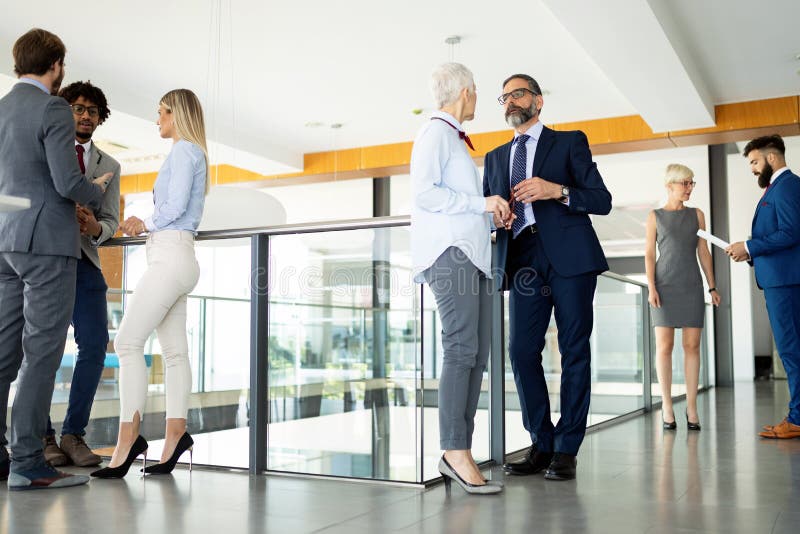 Group of Perspective Designers Discussing in Front of Office Stock ...